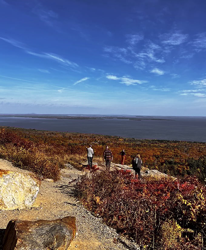 Visitors enjoy brilliant autumn colors and sweeping coastal scenery from Camden Hills State Park, making this scenic viewpoint a favorite Maine destination.
