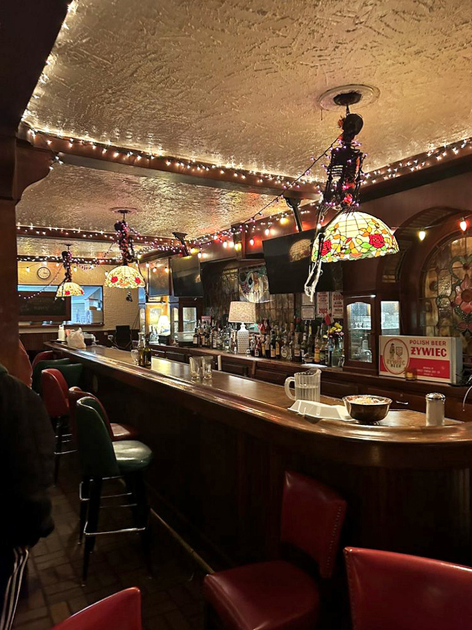 The bar area glows with Tiffany-style lamps and string lights, offering Polish vodkas and beers that pair perfectly with the hearty cuisine.