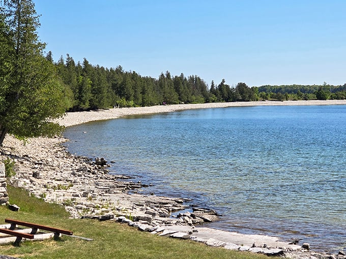 Crystal clear waters lap against the stony beach, creating a natural symphony that's been playing continuously for thousands of years.