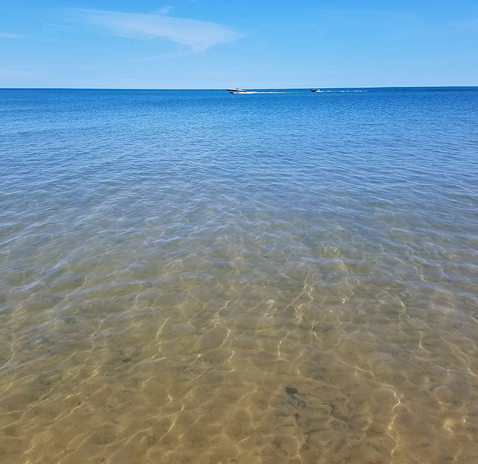Sunlight dances through impossibly clear waters, revealing the sandy canvas where beach glass hides in plain sight.