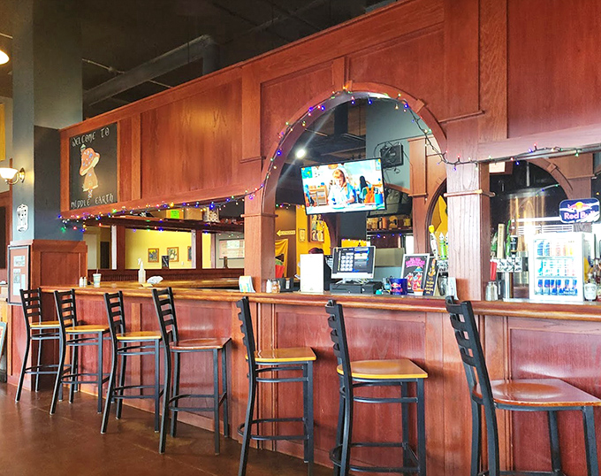 The bar area glows with warm invitation, where local brews flow and friendly staff serve patrons with hobbit-like hospitality.