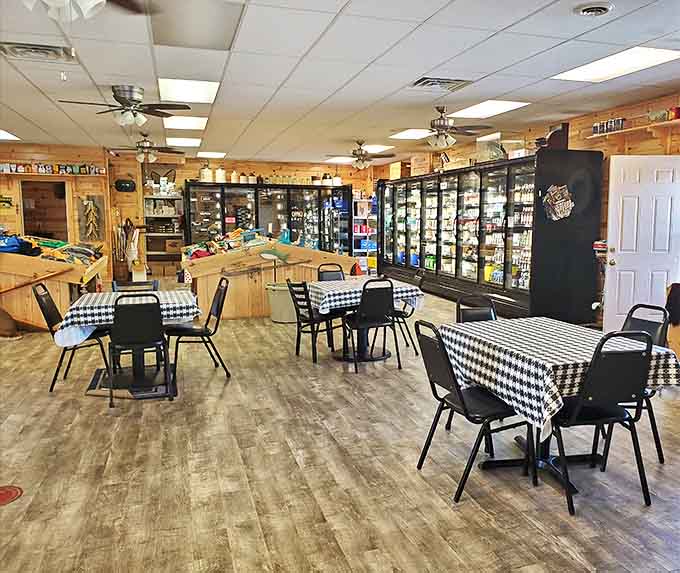 Simple tables with checkered cloths invite lingering conversations and shared meals in this unpretentious dining area.