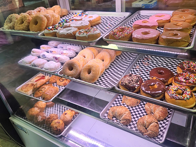 The donut display &ndash; where diet plans go to die happy deaths and "I'll just have one" becomes the day's biggest lie.
