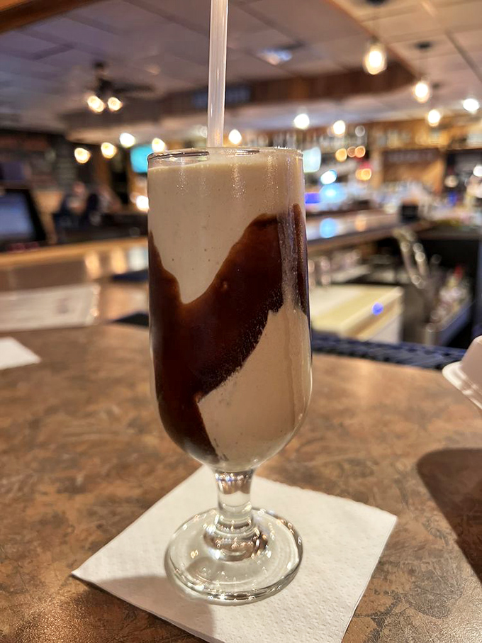 Root beer floats bringing that perfect nostalgic sweetness, proof that some childhood favorites absolutely belong in adult dining experiences.