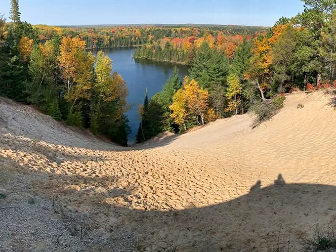 Fall's fiery display reaches peak drama at Foote Pond, where the trees seem to be competing for who can wear the brightest outfit.