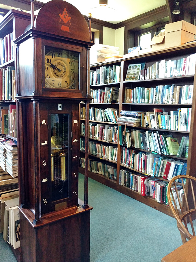 The magnificent grandfather clock, topped with Masonic symbols, measures reading time in gentle ticks rather than jarring digital alerts.