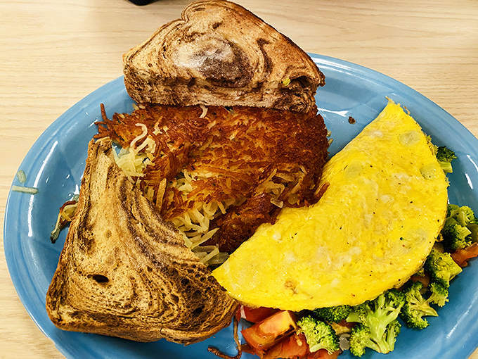 Breakfast perfection at Drifters Restaurant combines fluffy omelets, crispy hash browns, and marbled toast &ndash; the holy trinity of morning satisfaction.