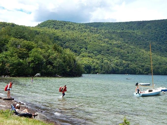 Summer swimmers brave the refreshingly cool waters, a perfect antidote to Vermont's gentle summer heat.