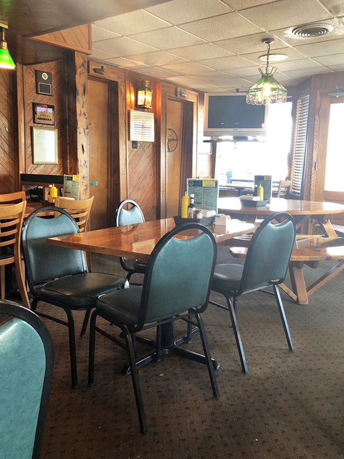Simple wooden tables await hungry patrons, promising no pretension, just a solid surface for what might be the best burger of your life.