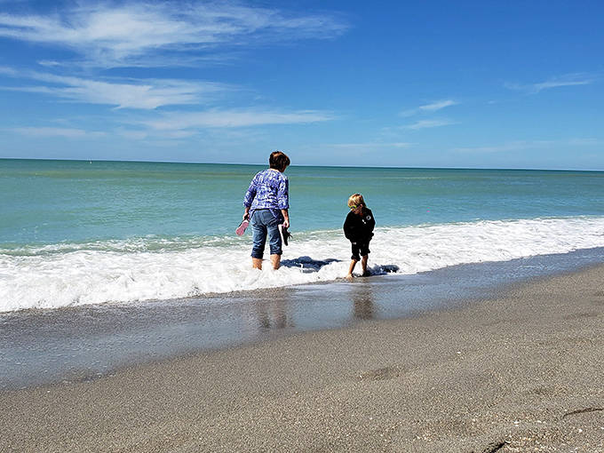 Visitors: Generations connect through the timeless joy of splashing in waves that have been entertaining humans since time began.