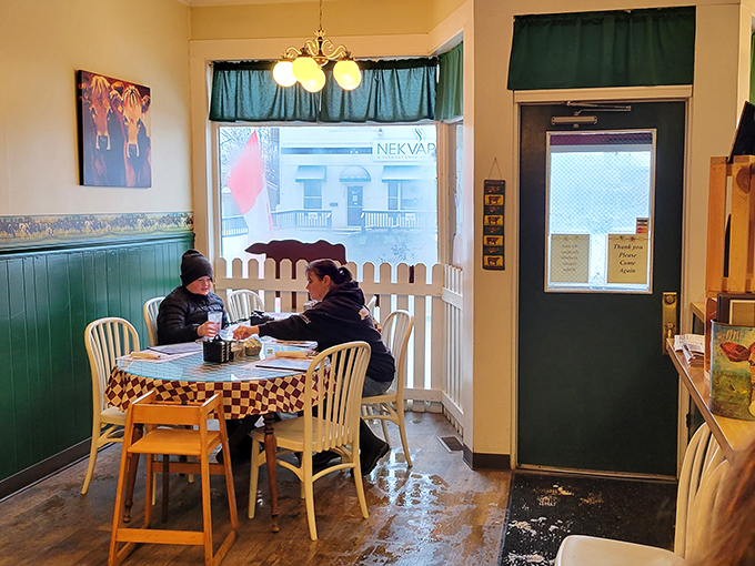 A cozy corner table by the window &ndash; prime real estate for people-watching while enjoying your breakfast.