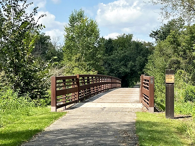 This sturdy wooden bridge invites travelers to cross, promising new adventures on the trail beyond.