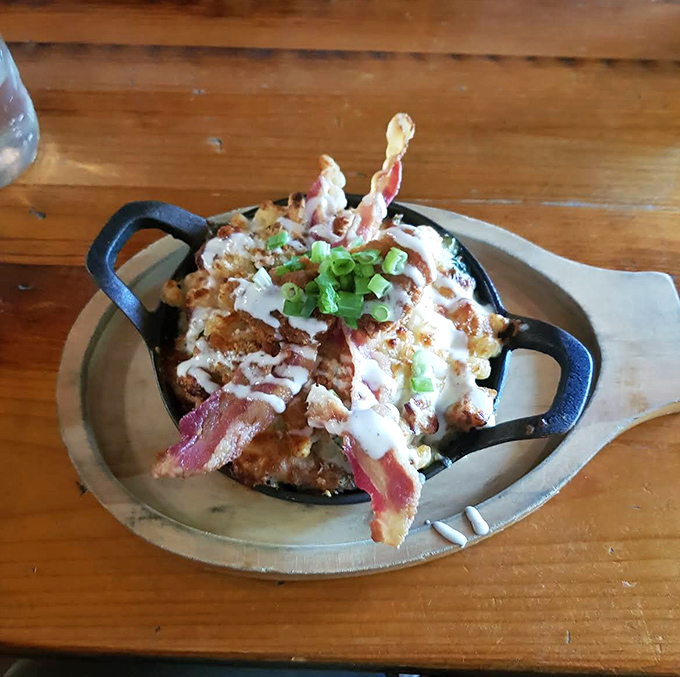 Bacon makes everything better, especially when it's crowning a skillet of bubbling mac and cheese like a crispy pork tiara.