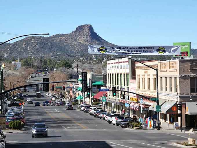 Main street stretches toward distinctive peaks where Old West history meets modern mountain town charm.