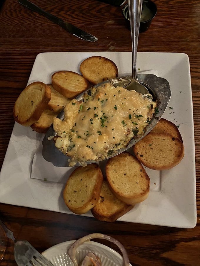 Artichoke dip that bubbles with molten cheese goodness, surrounded by perfectly toasted bread &ndash; the starter that threatens to steal the show.