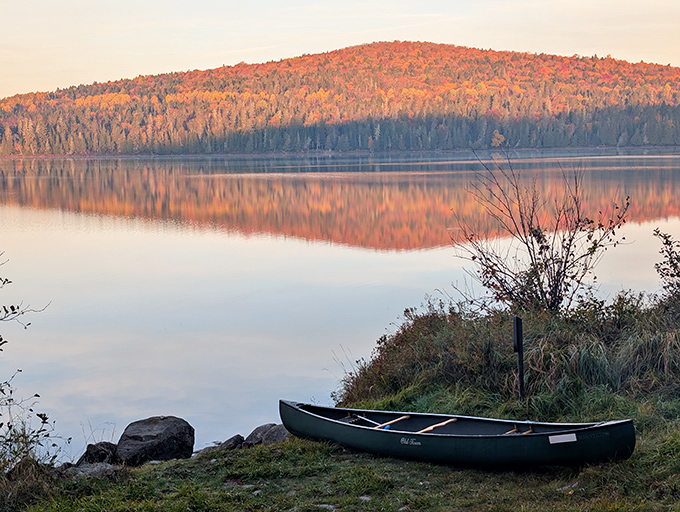 Autumn transforms the waterway into a painter's palette, where every canoe stroke reveals new compositions of color and light.