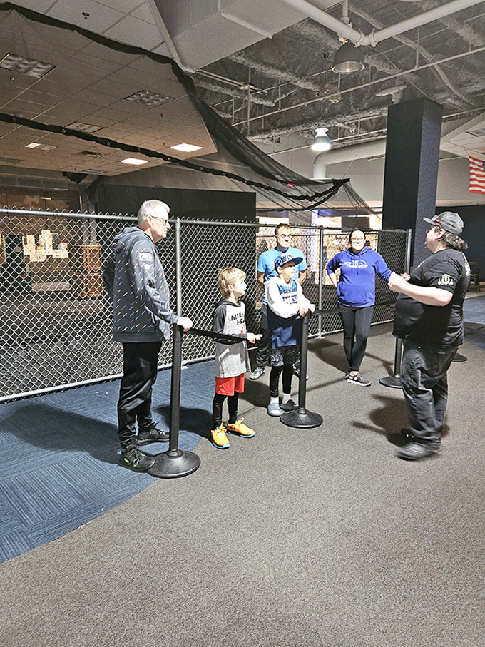 A young sharpshooter takes careful aim from behind cover, embodying the perfect blend of caution and courage.