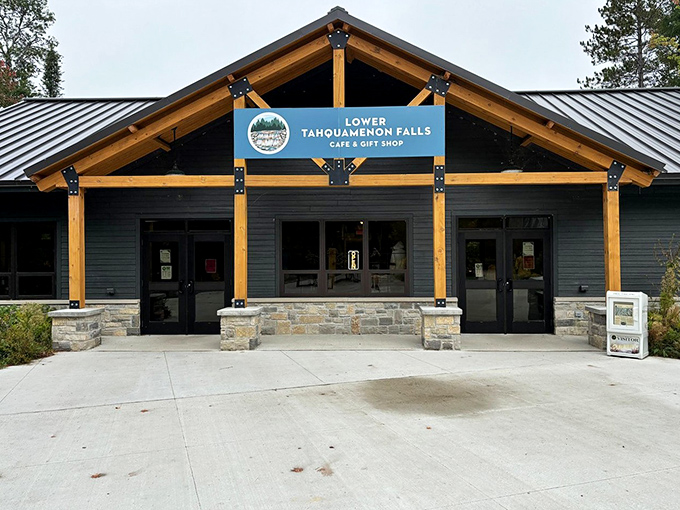 The Lower Falls Caf&eacute; welcomes hungry adventurers with its rustic timber frame design, promising hearty meals after a day of waterfall exploration.