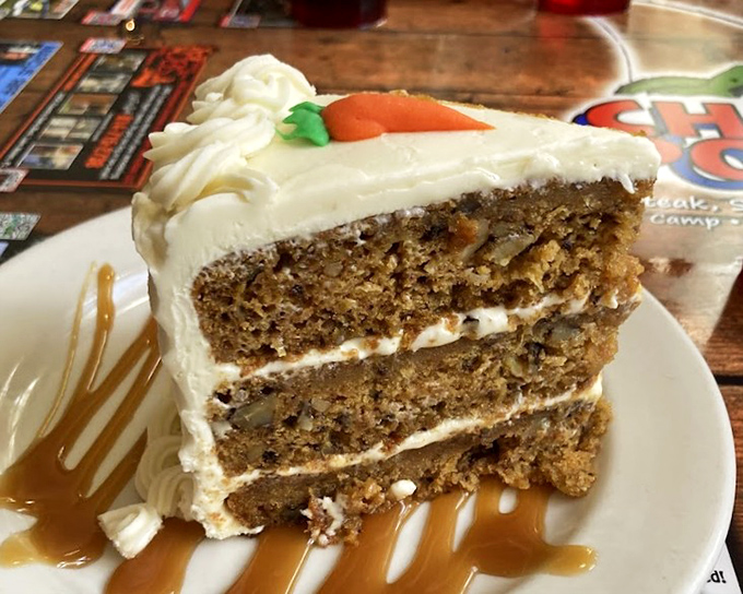 Carrot cake standing tall and proud &ndash; three layers of spiced perfection with cream cheese frosting that would make grandmothers jealous.