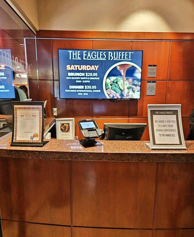 The welcoming counter displays daily specials and pricing, including Saturday's popular brunch featuring bloody marys and mimosas.