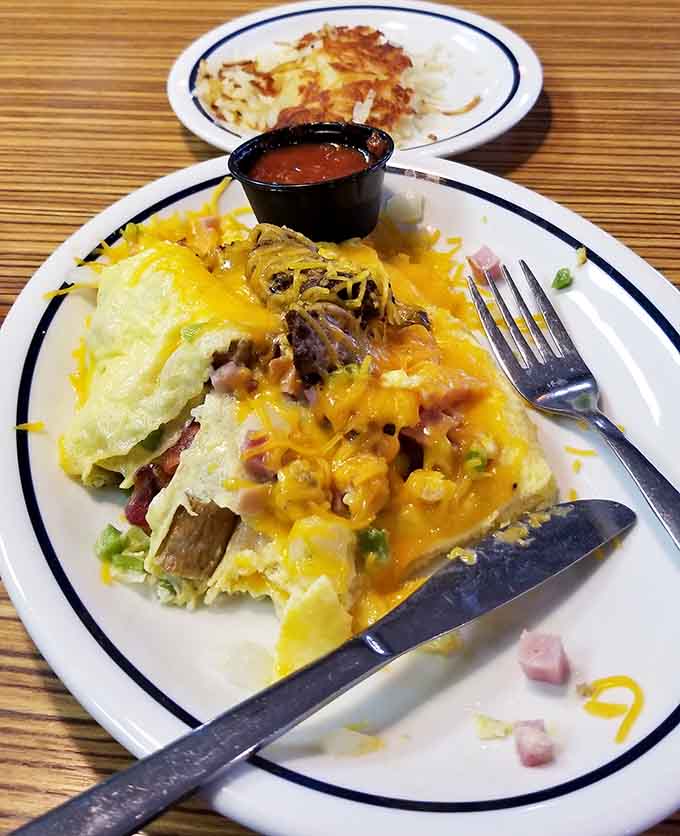 The Colorado omelet arrives loaded with chilies and cheese, proving that breakfast food is acceptable at any hour of the day or night.