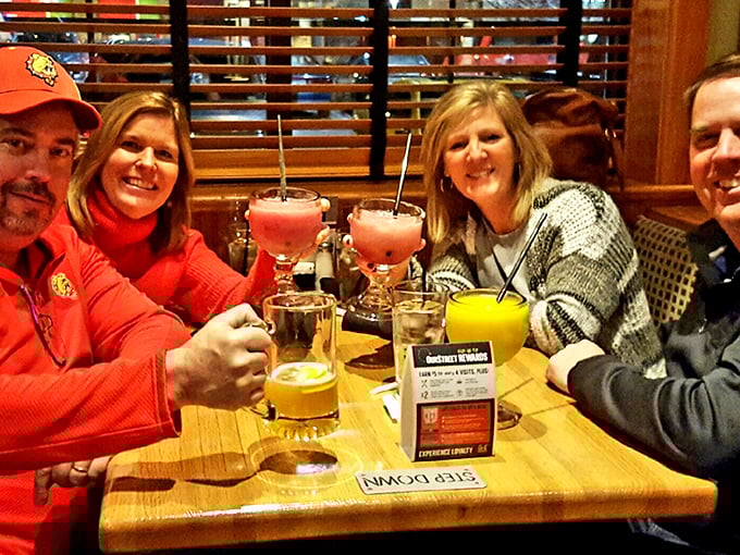 Happy diners toast to good food and better company, proving that Schuberg's serves up community alongside its famous burgers.