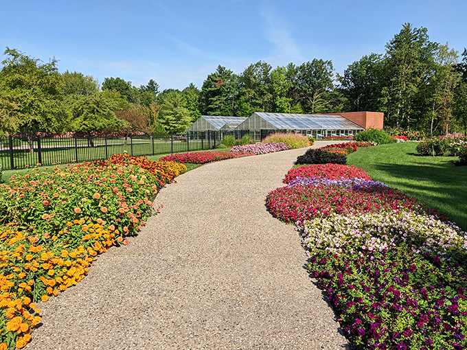 A horticultural masterpiece where flowers perform their colorful choreography against a backdrop of manicured perfection.