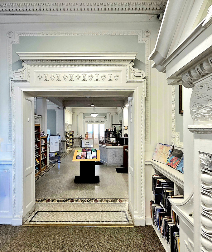 Elaborate moldings frame this entryway where history and modern library services blend seamlessly, welcoming visitors of all ages.