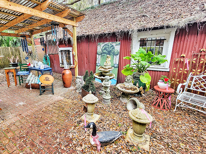 Finch House: nature reclaims the edges of this historic home-turned-shop, where flowering plants frame the brick pathway to antiquing adventures.