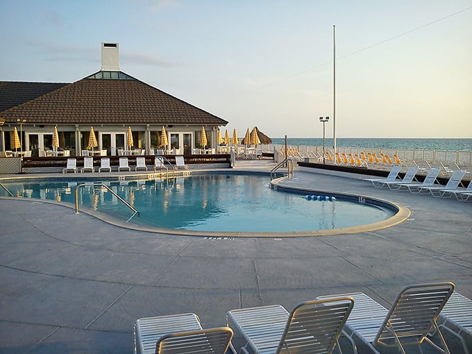 Resort elegance meets beachfront relaxation at this exclusive club, where the pool seemingly merges with the Gulf beyond.