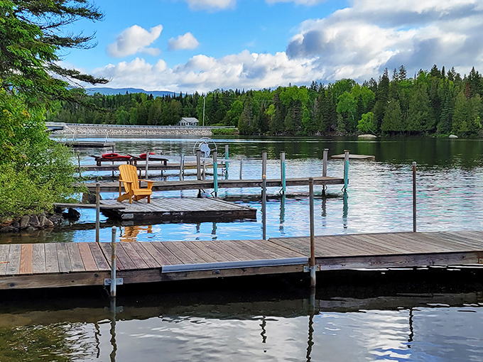 Wooden docks waiting patiently for morning coffee drinkers and sunset dreamers to claim their Adirondack thrones.