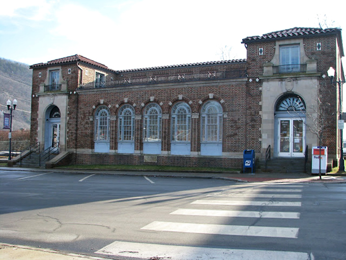 The Post Office's Spanish Colonial Revival architecture stands out in this New England town, its arched windows and symmetrical design exuding timeless dignity.