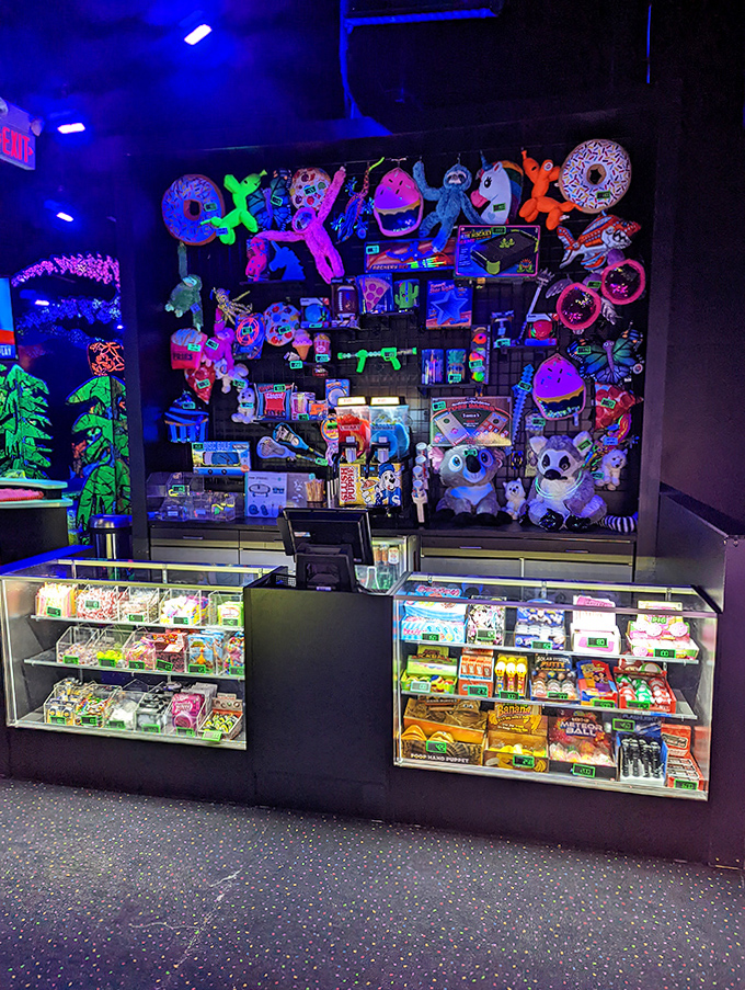 A neon wonderland where nostalgia glows bright—toys, games, and prizes that light up childhood dreams under black lights.