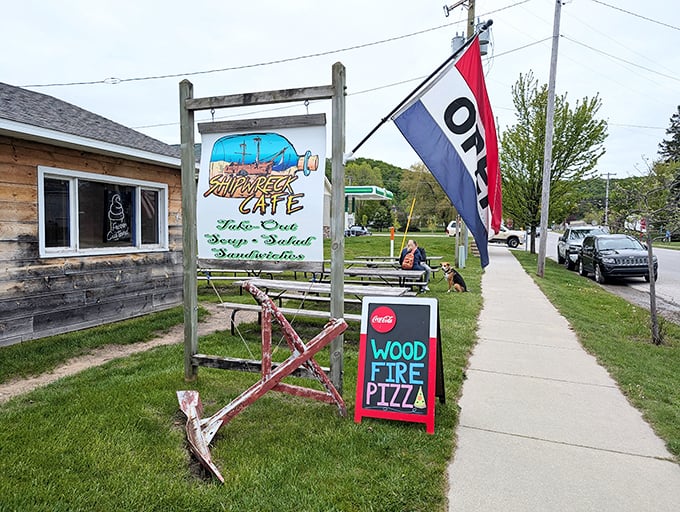 Shipwreck Cafe's weathered wood exterior and hand-painted sign signal authentic local flavors worth discovering.