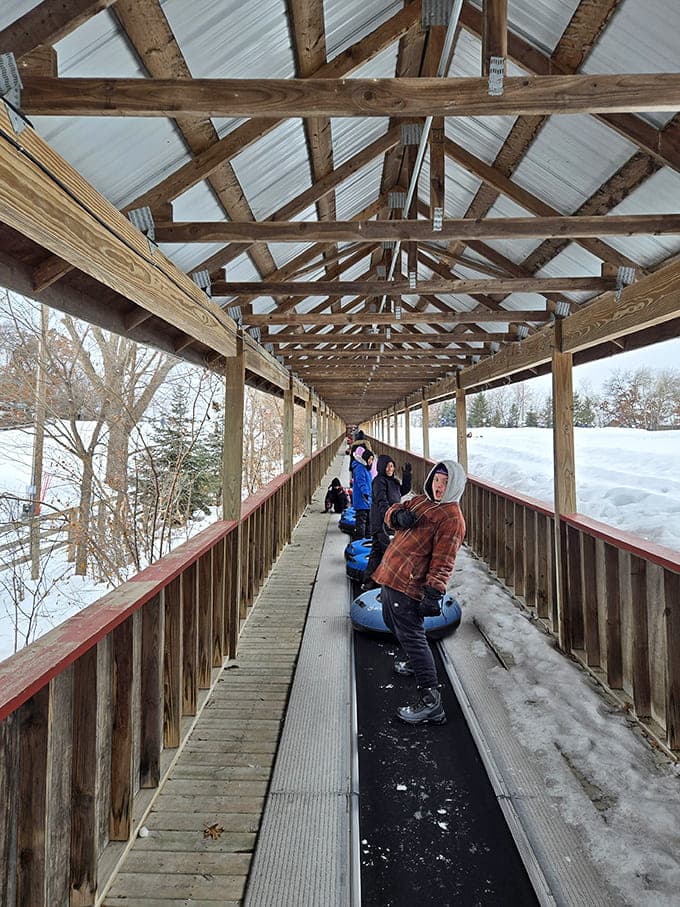 That conveyor belt system is pure genius, hauling tubers uphill so they can focus their energy on the important part: going down.