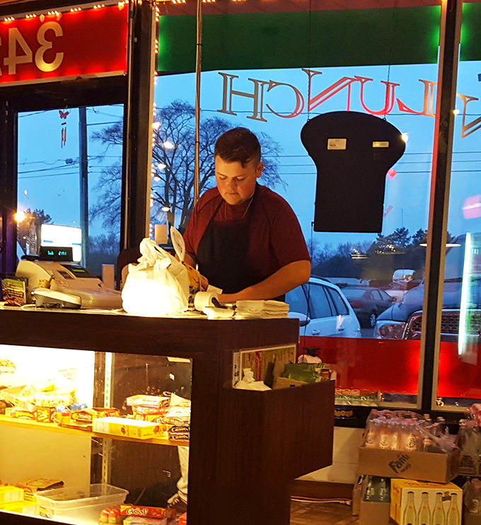 The friendly staff member working the counter knows that hospitality matters just as much as seasoning when it comes to memorable meals.