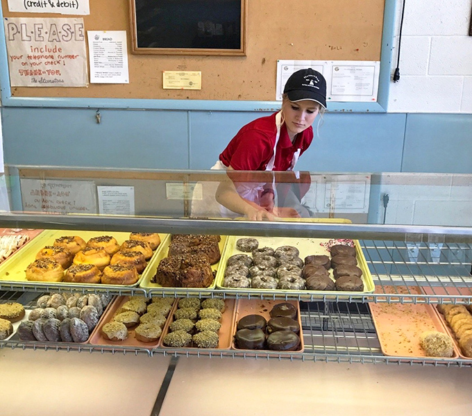 Behind every great pastry is a dedicated baker, crafting edible joy one tray at a time. The red uniform means business &ndash; serious baking business.