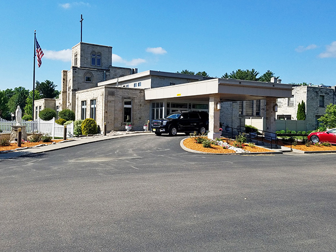 This dignified stone entrance has welcomed visitors through decades of Wisconsin weather, its craftsmanship a testament to bygone building arts.