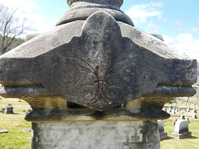 Centuries of Vermont weather have softened this ornamental detail, revealing the gentle artistry of time itself.