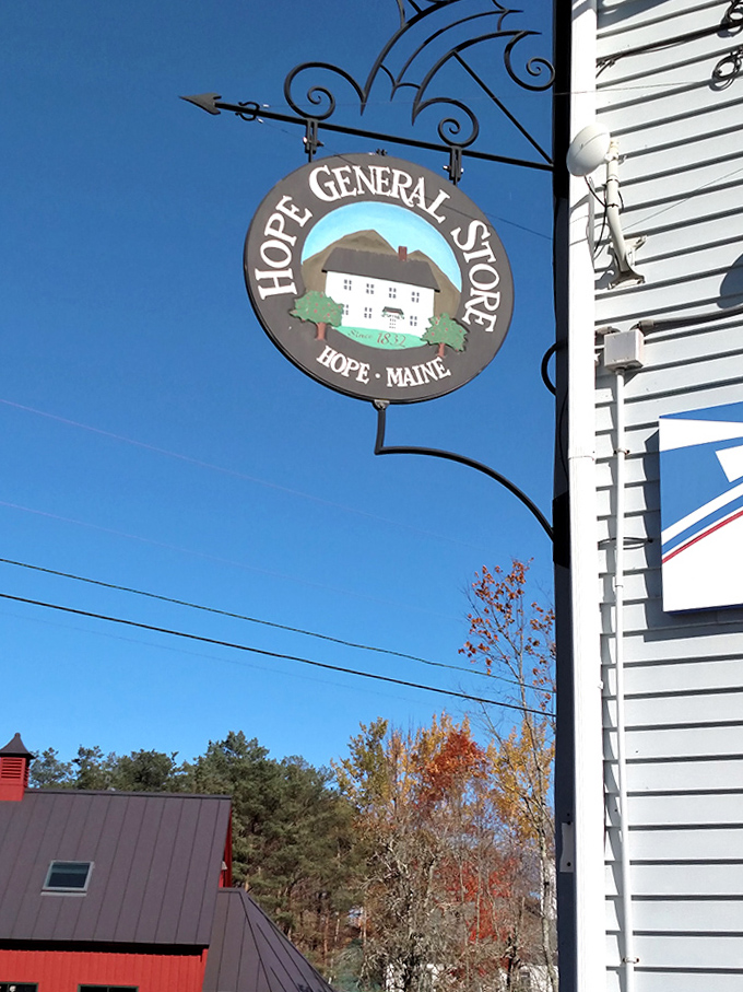 The circular store sign depicts the building itself &ndash; a meta moment of small-town branding that's both charming and practical for navigation.