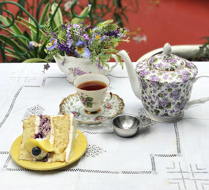 Tea service elevated to art form, with flowers that complement rather than compete with that slice of blueberry cake.