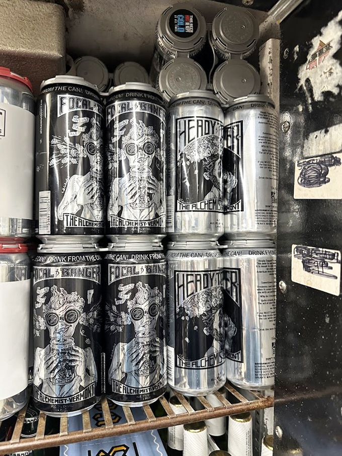 Coveted cans from The Alchemist brewery make special appearances, their distinctive black and white designs standing out like celebrities.