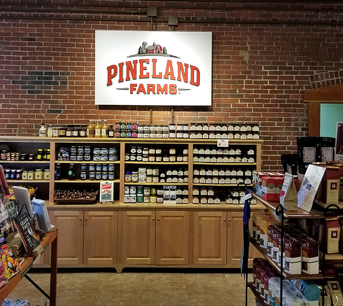 The market shelves showcase Pineland Farms' commitment to quality, with products arranged like treasures waiting to be discovered by discerning food lovers.