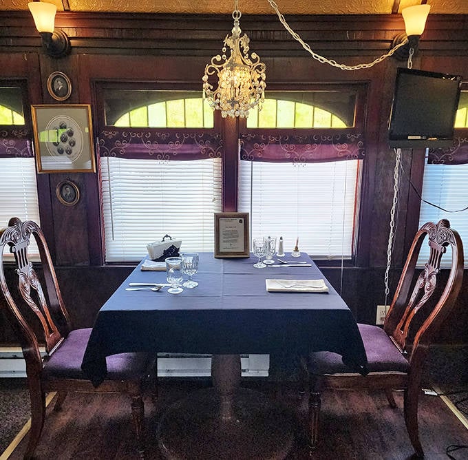 Enjoy a romantic meal for two under a sparkling chandelier, with beautiful views out of this arched train windows.le