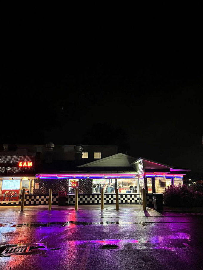 As darkness falls, Al's neon glow becomes a beacon of comfort for hungry travelers and night owls seeking satisfaction.