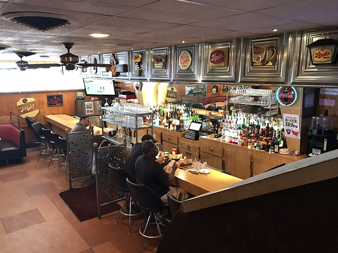 The bar area stands ready for Detroit sports fans and pizza aficionados alike &ndash; where debates about toppings are settled over cold beverages.