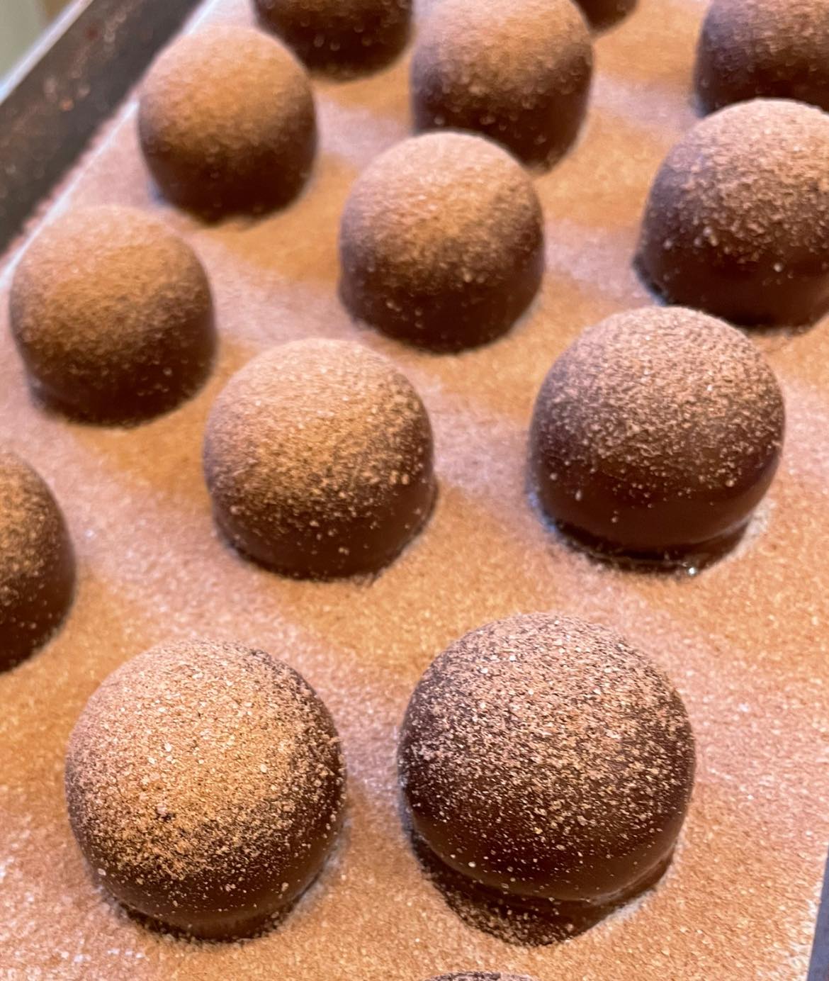 These chocolate truffles aren't just sitting there looking pretty &ndash; they're plotting a delicious takeover of your taste buds with military precision.