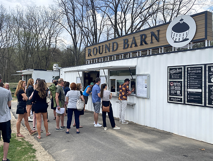 Line of anticipation: Eager visitors queue up at the outdoor service counter, their patience soon to be rewarded with craft beverages worth the wait.