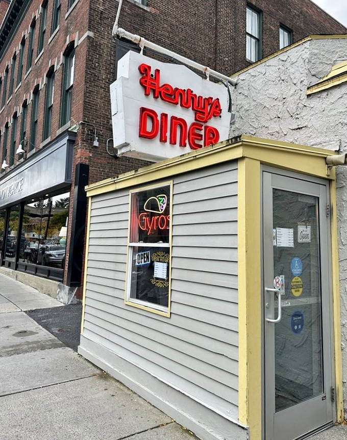 The entrance welcomes you with that iconic red Henry's Diner sign, a beacon for anyone who appreciates breakfast done right and nostalgia served fresh.