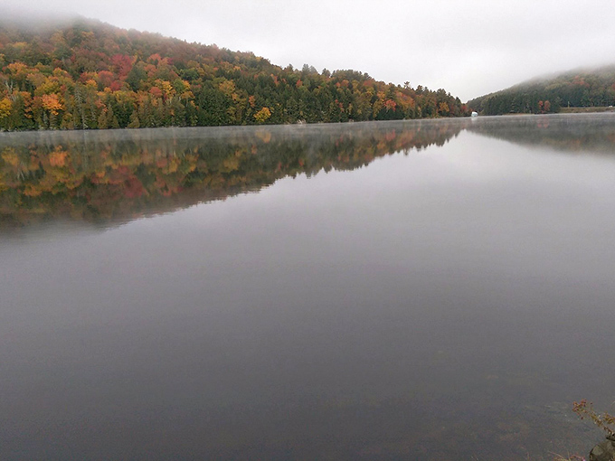 Morning fog rolling across Lake Willoughby like nature's own special effects department decided to add some mystery to the scenery.
